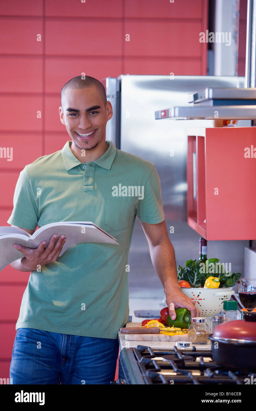 Man reading cookbook hi-res stock photography and images - Alamy