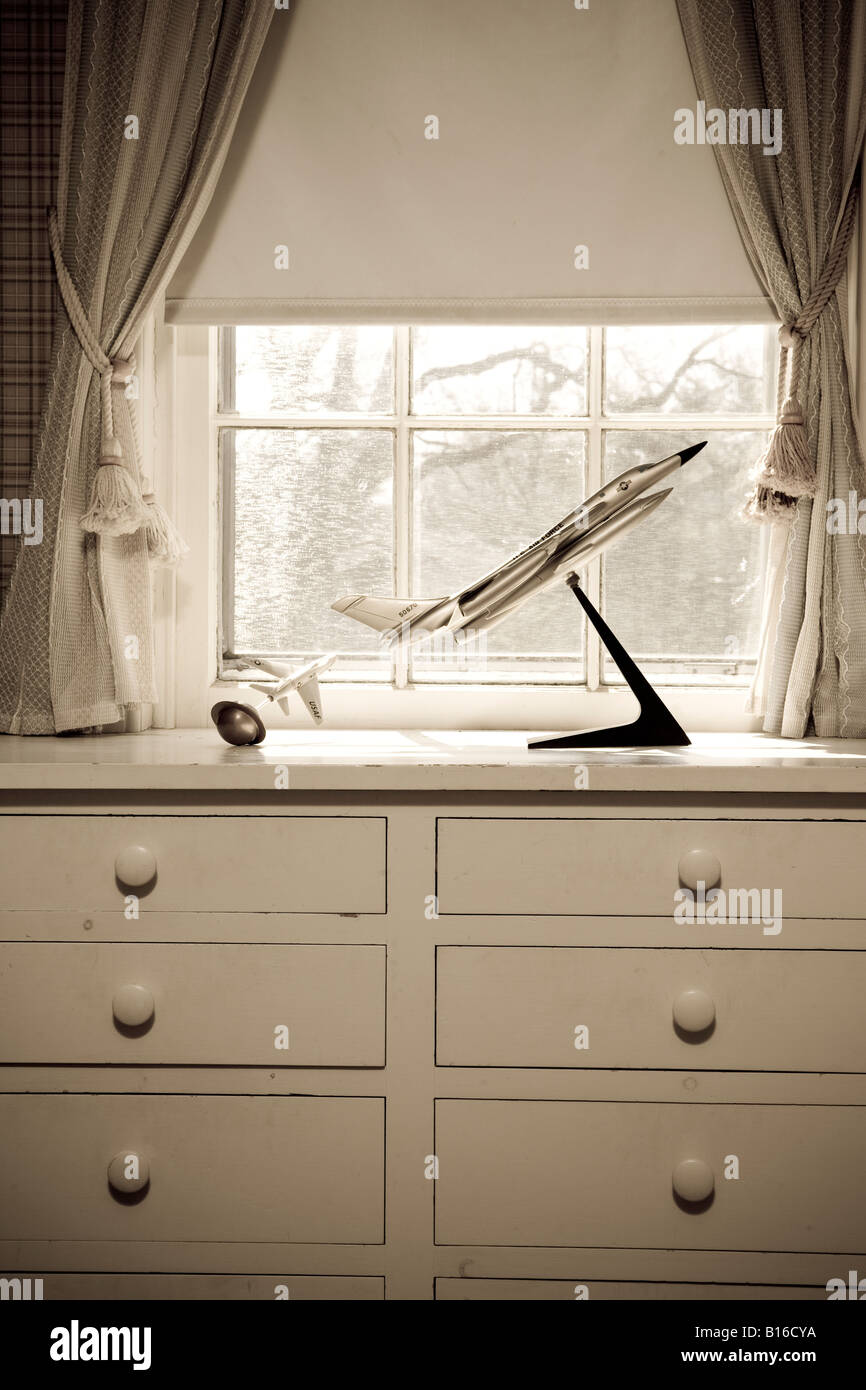 A window sill with a model airplane Stock Photo - Alamy