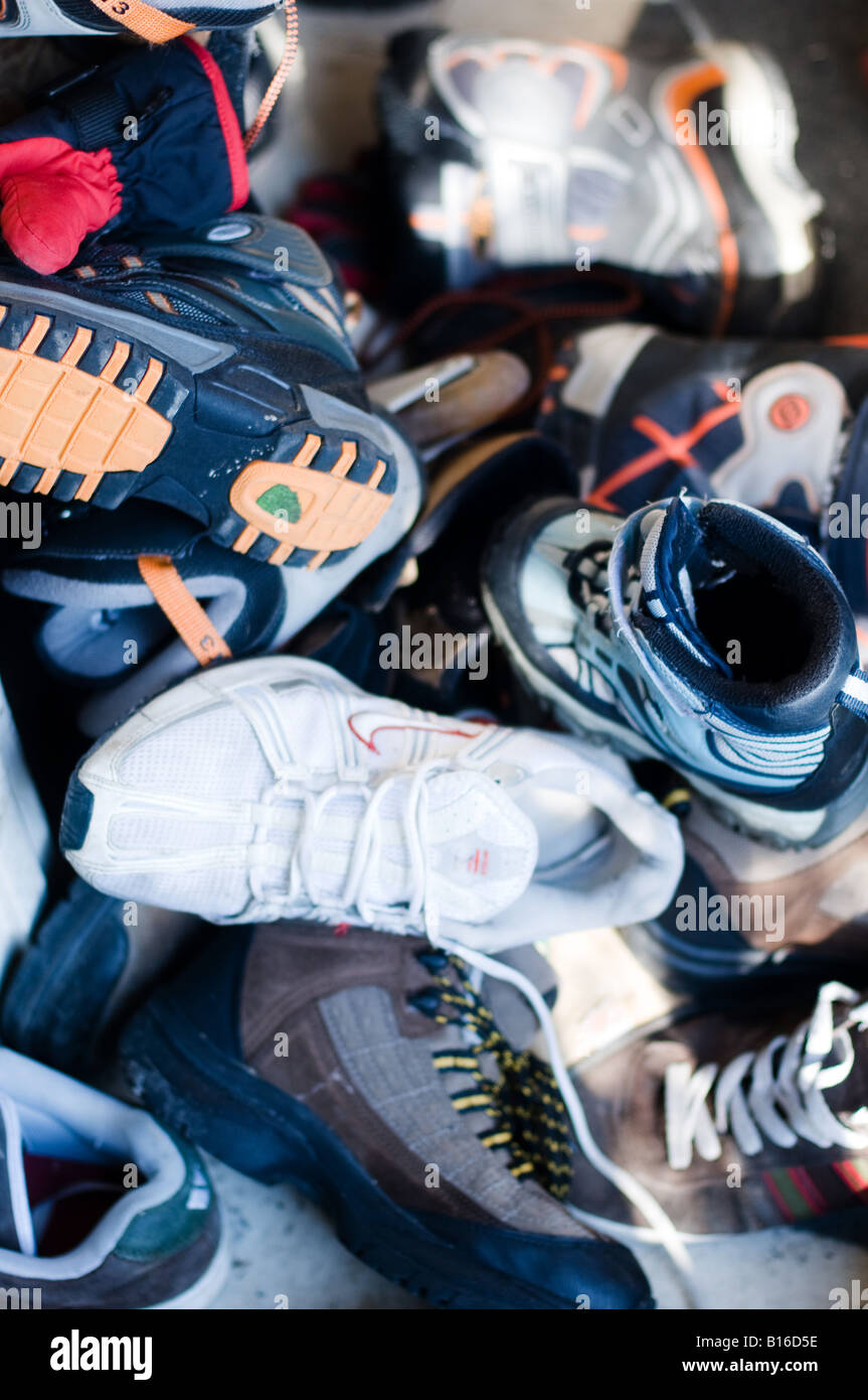 Many different shoes stacked ontop one another in a pile Stock Photo ...