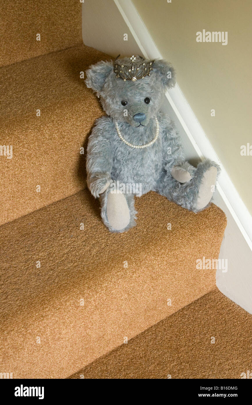 adorable teddy bear sitting on stairs Stock Photo - Alamy