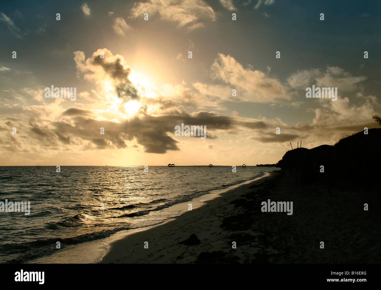 Tropical beach sunset water sea Stock Photo - Alamy
