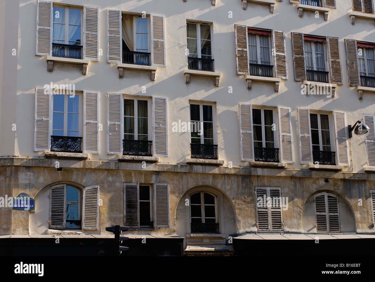 Windows and blinds in Grenelle street Paris Stock Photo - Alamy