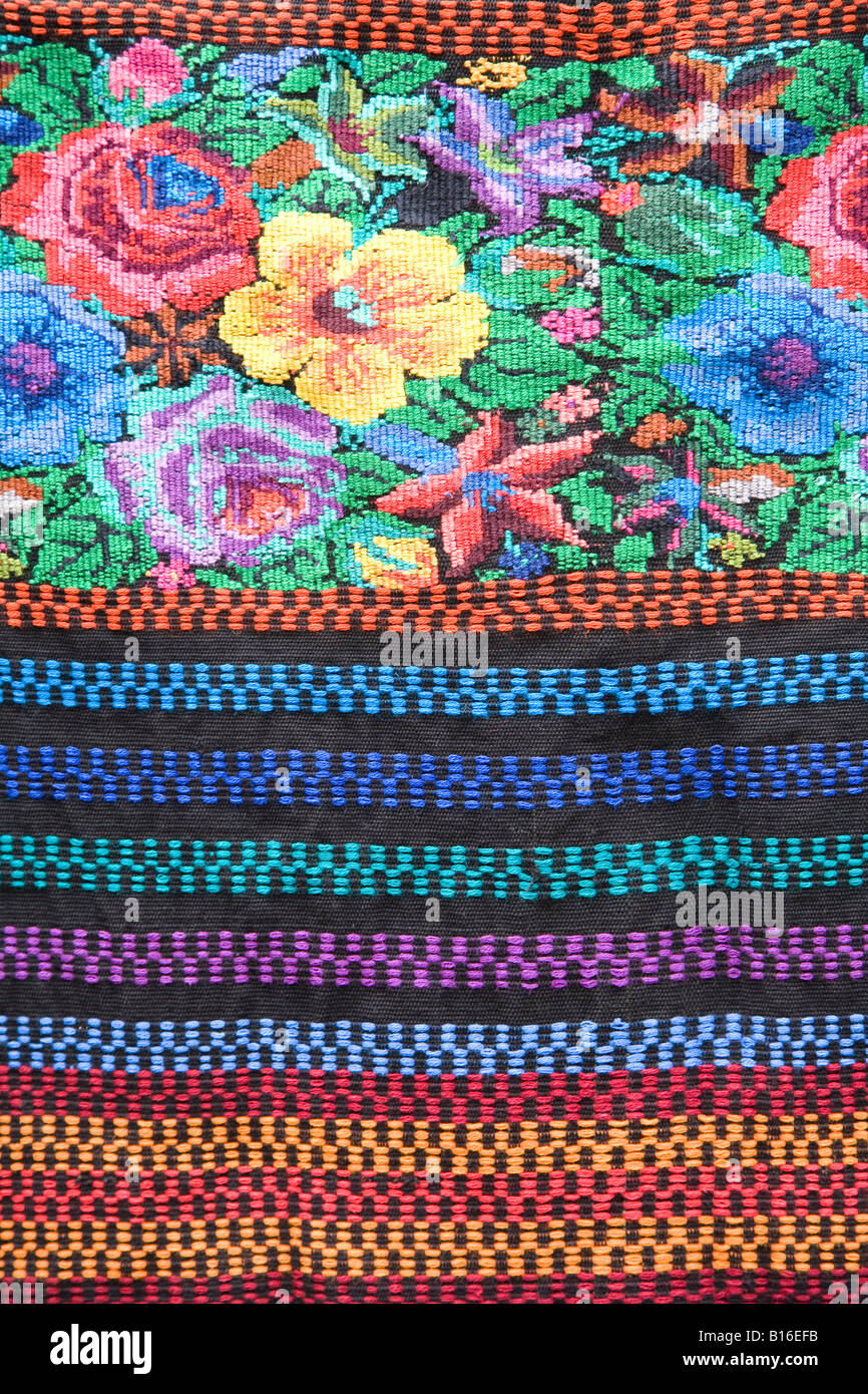 Brightly coloured fabric woven by a Mayan woman Stock Photo - Alamy