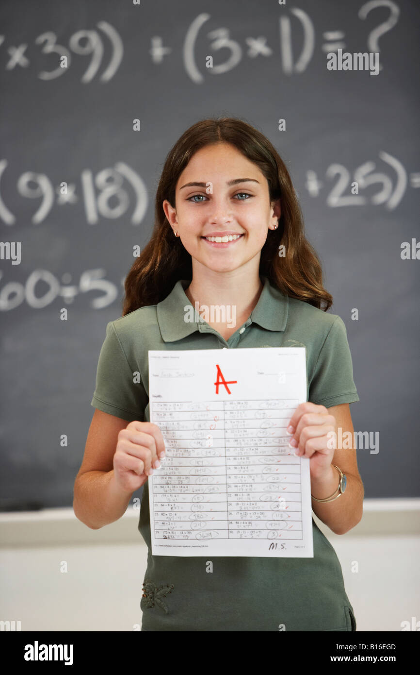 Girl holding up A paper Stock Photo - Alamy