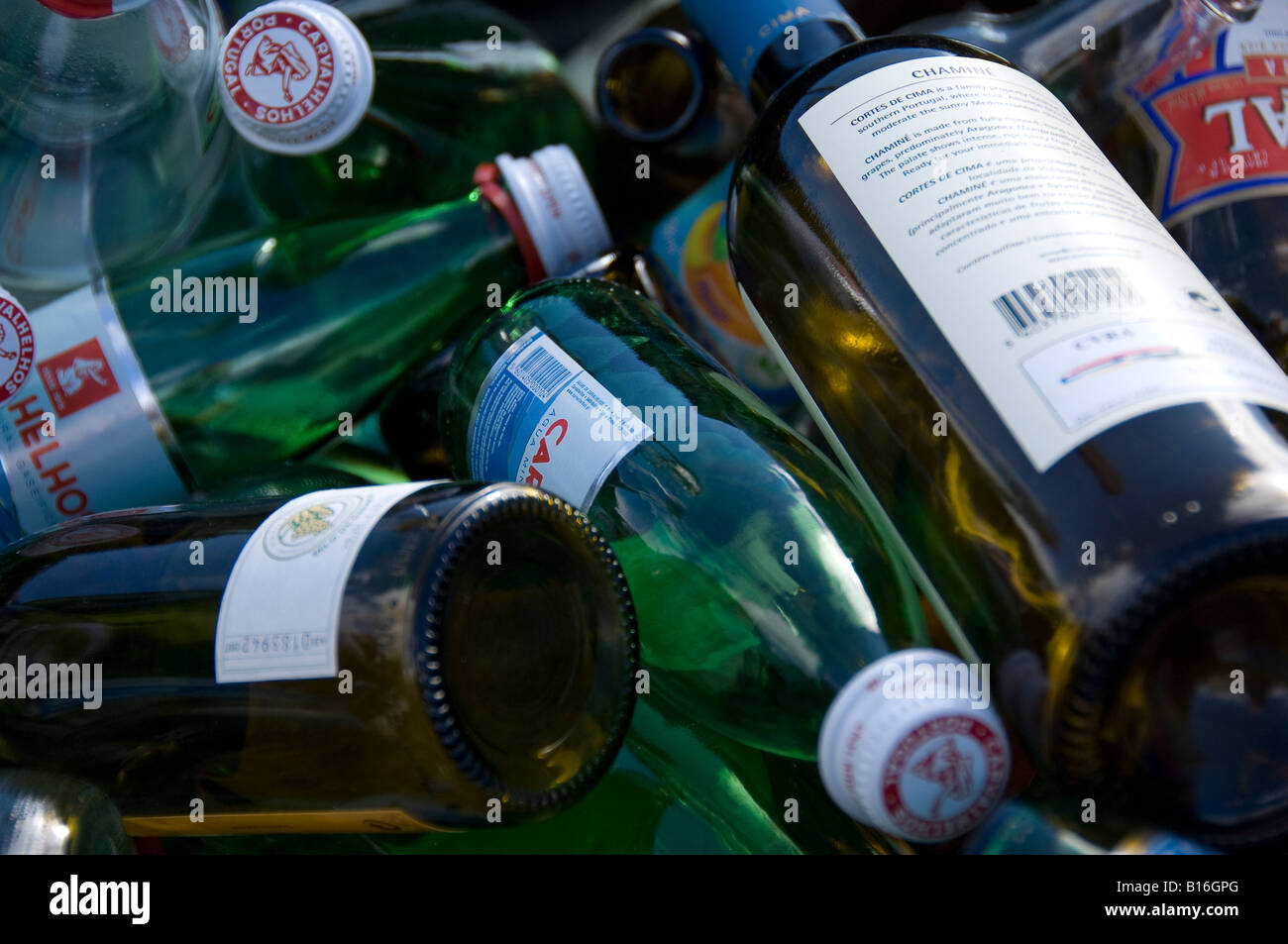 Close up of empty discarded bottles bottle in a waste recycling bin ...