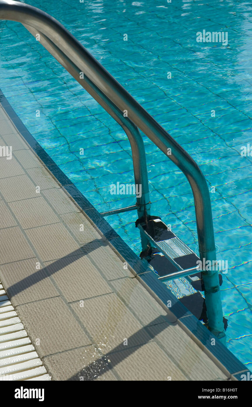 Steps down to swimming pool detail Stock Photo - Alamy