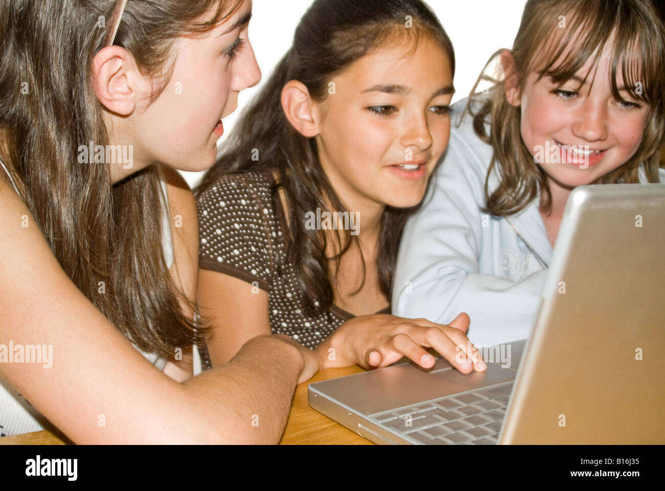 Horizontal close up of teenage girls laughing and giggling whilst ...