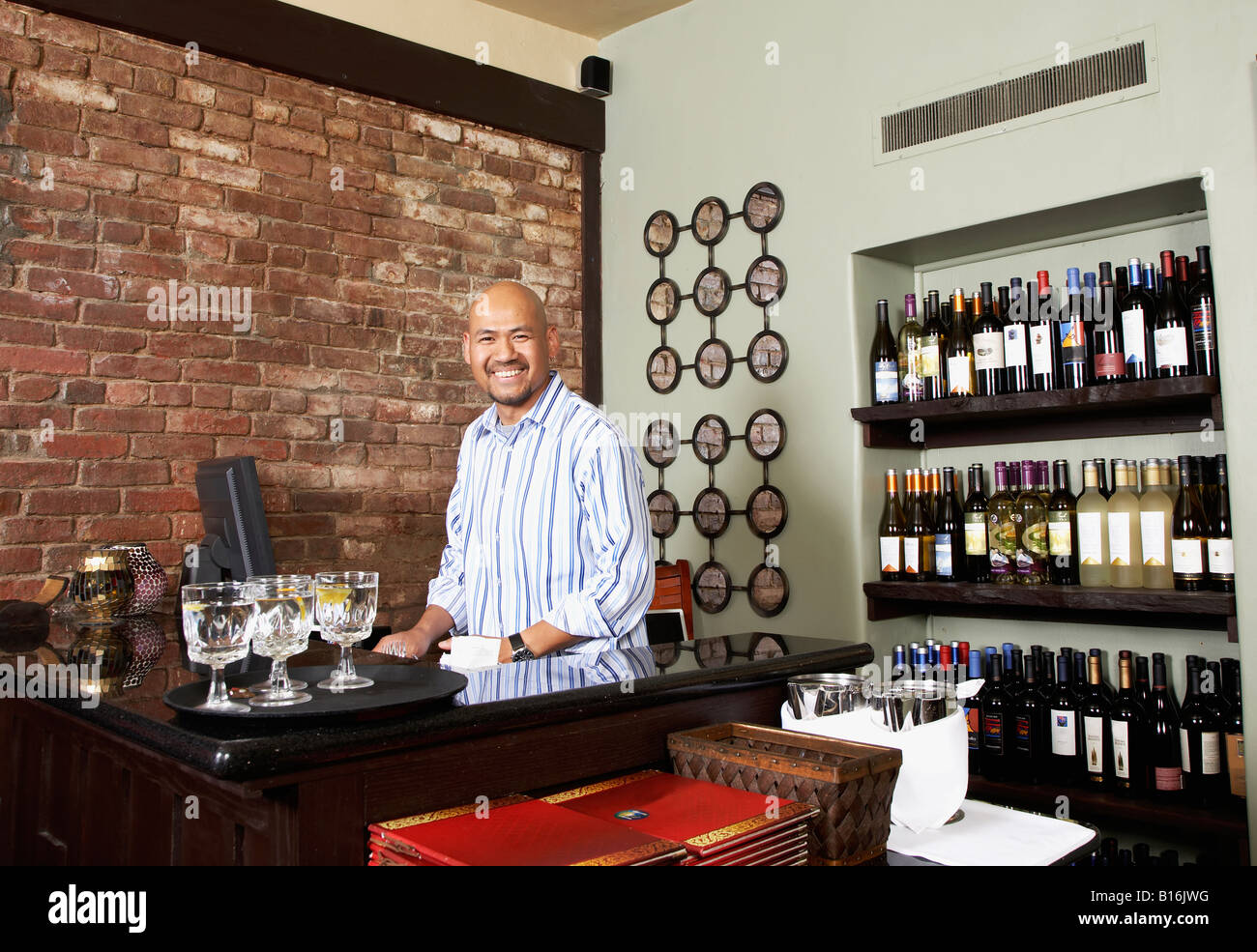 Asian man working at restaurant Stock Photo - Alamy