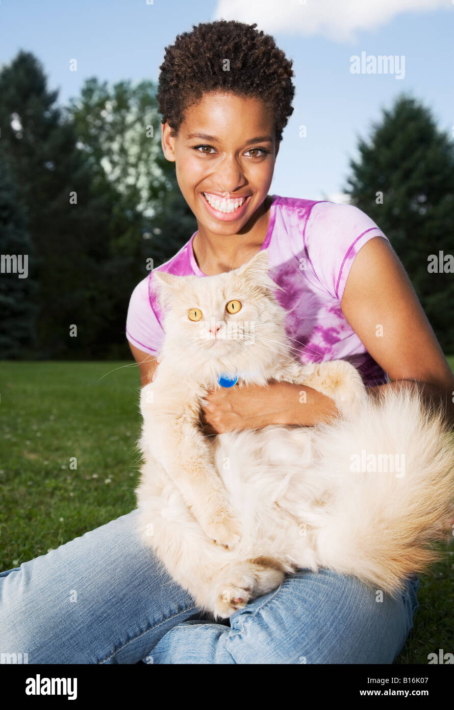 African American woman holding cat Stock Photo - Alamy