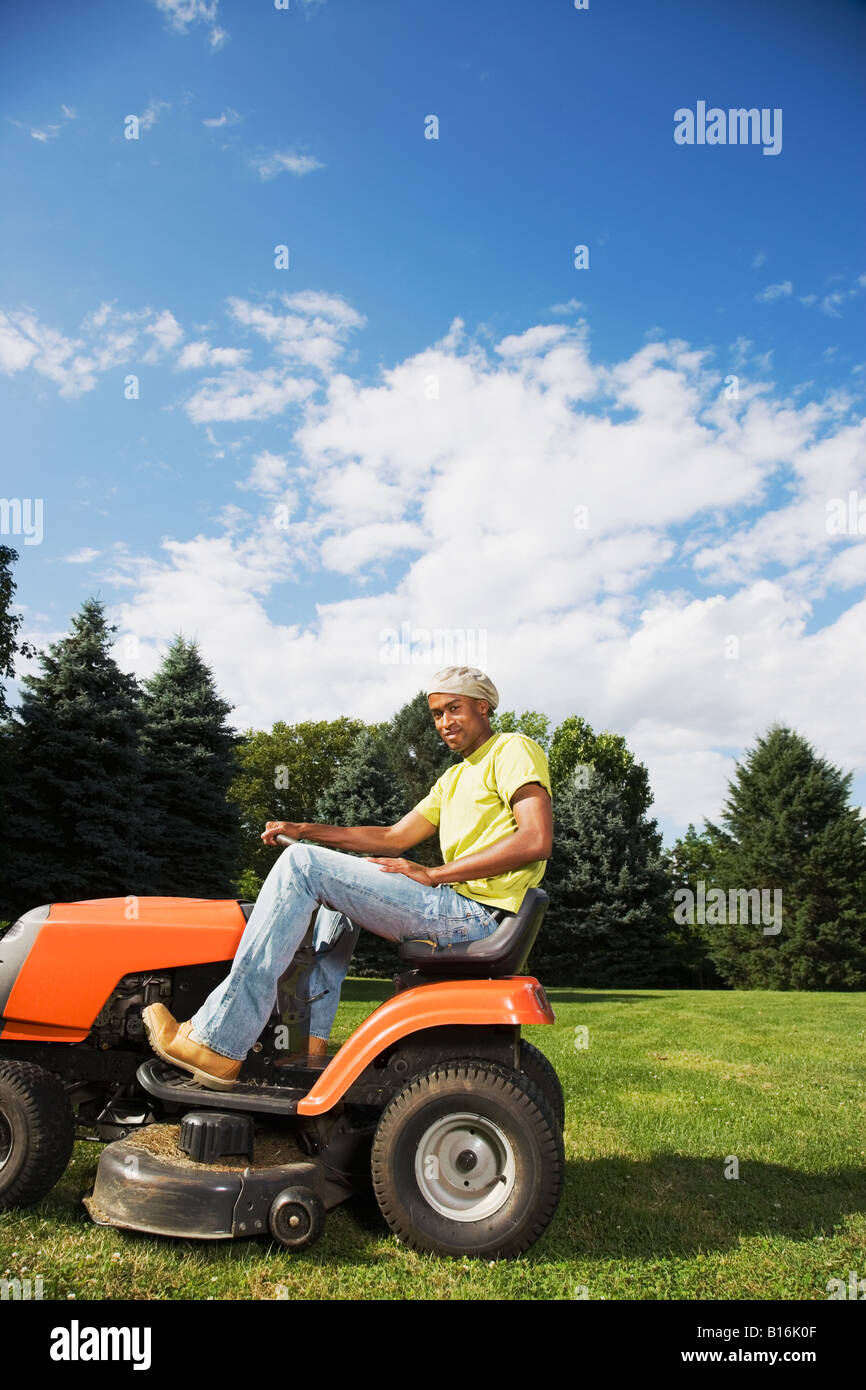 African American man mowing lawn Stock Photo - Alamy