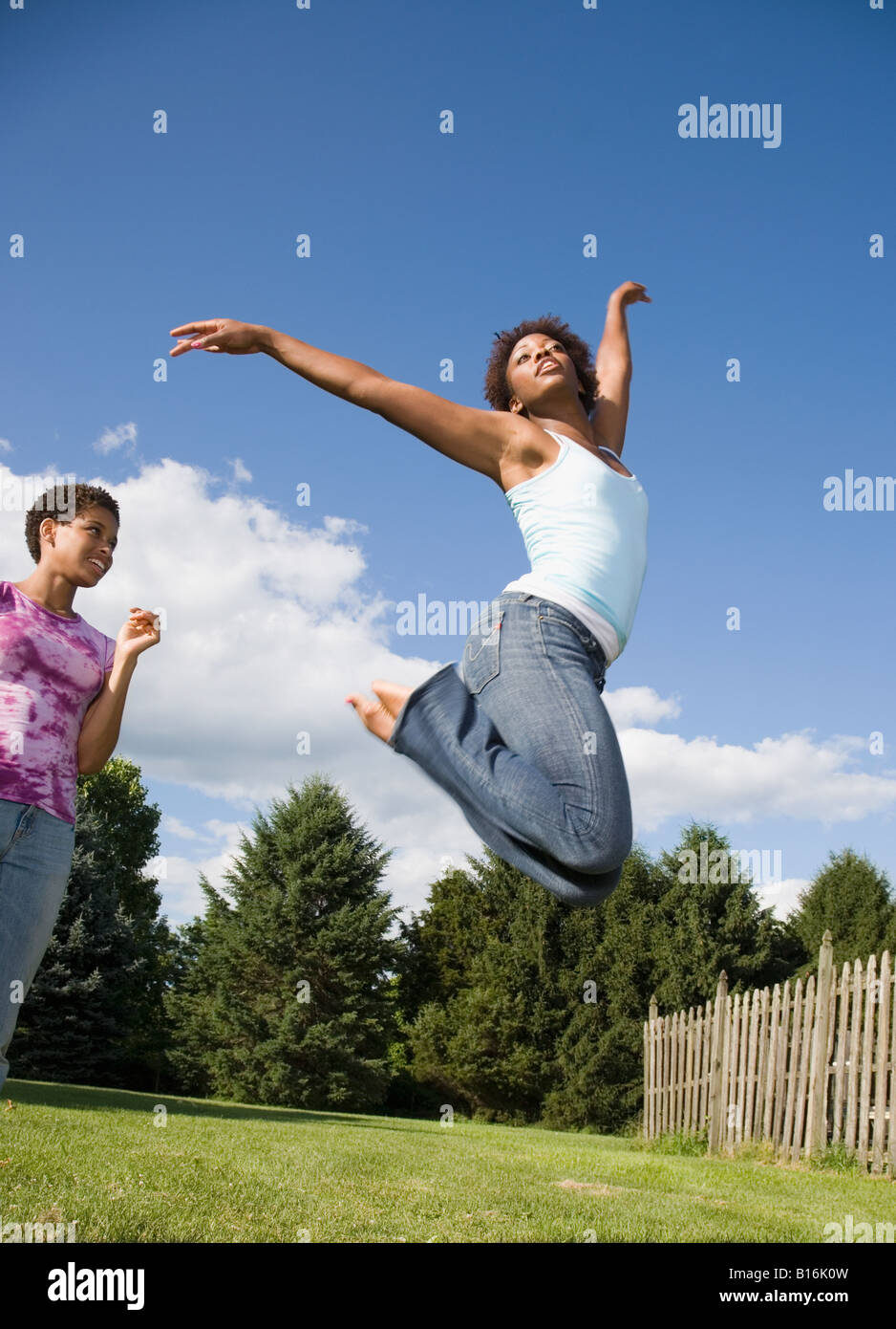 African American woman jumping Stock Photo - Alamy
