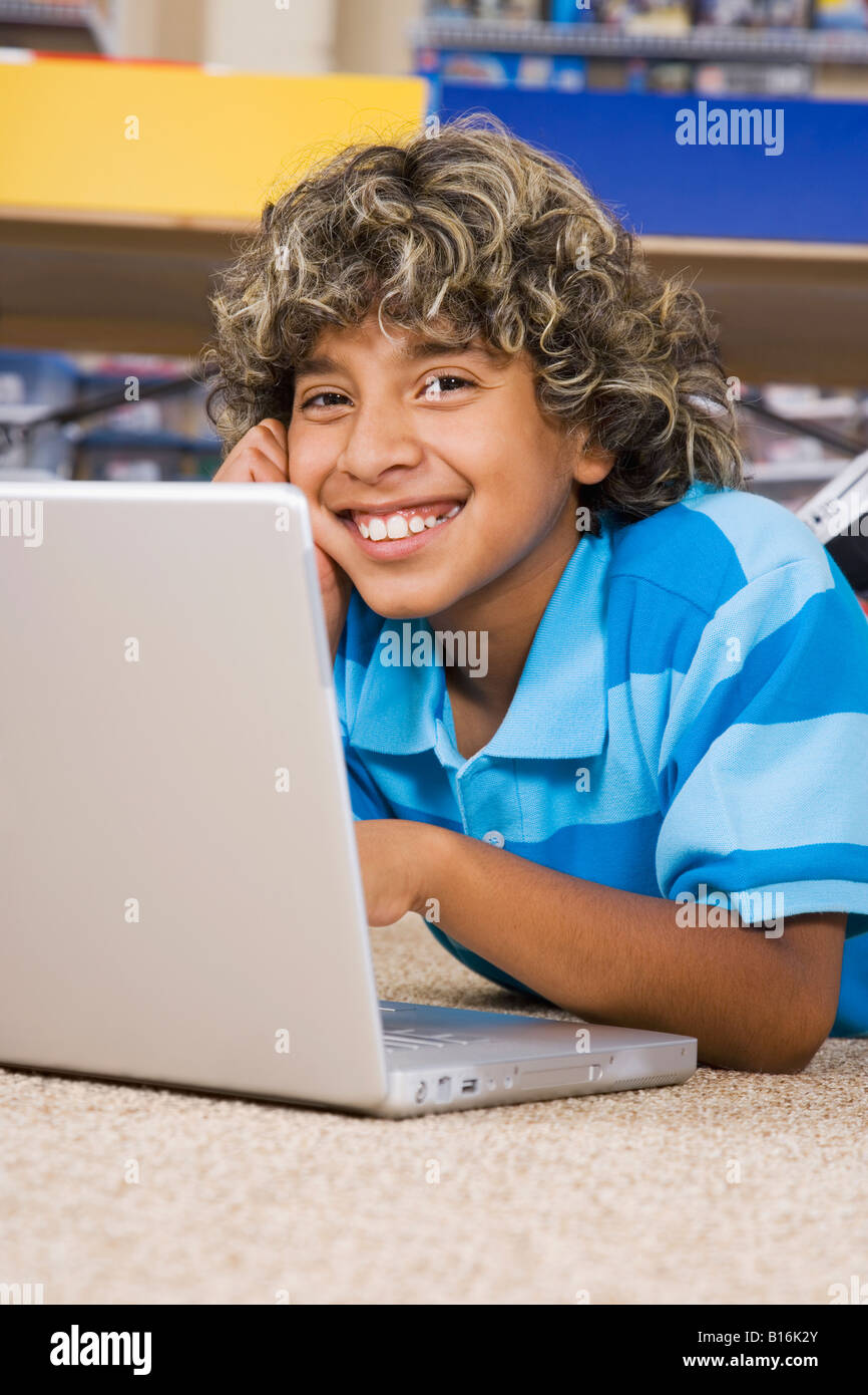 Hispanic boy typing on laptop Stock Photo - Alamy