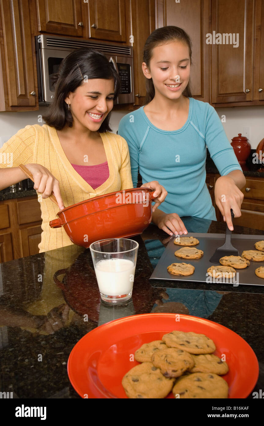 Multi-ethnic girls baking cookies Stock Photo - Alamy
