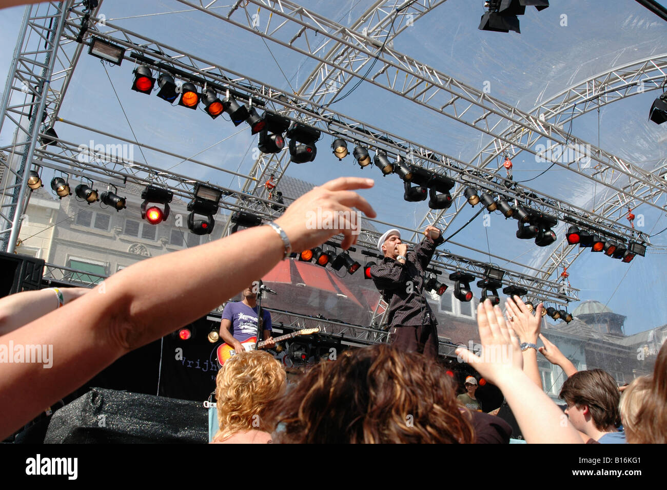 Young people attend the music concert hi-res stock photography and ...