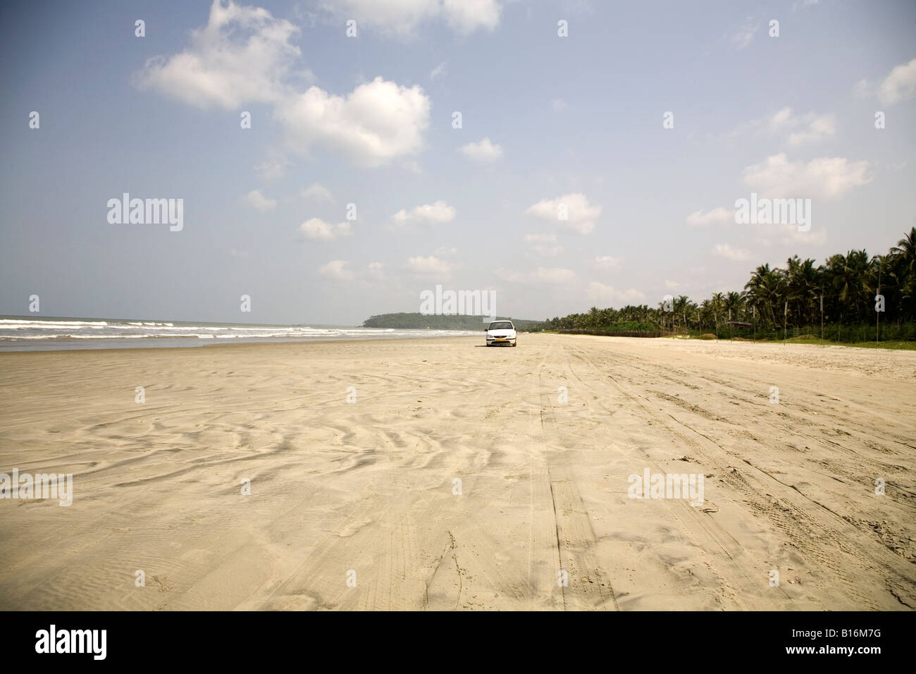 A car drives on Muzhappilangad Drive In Beach near to Thalassery in ...