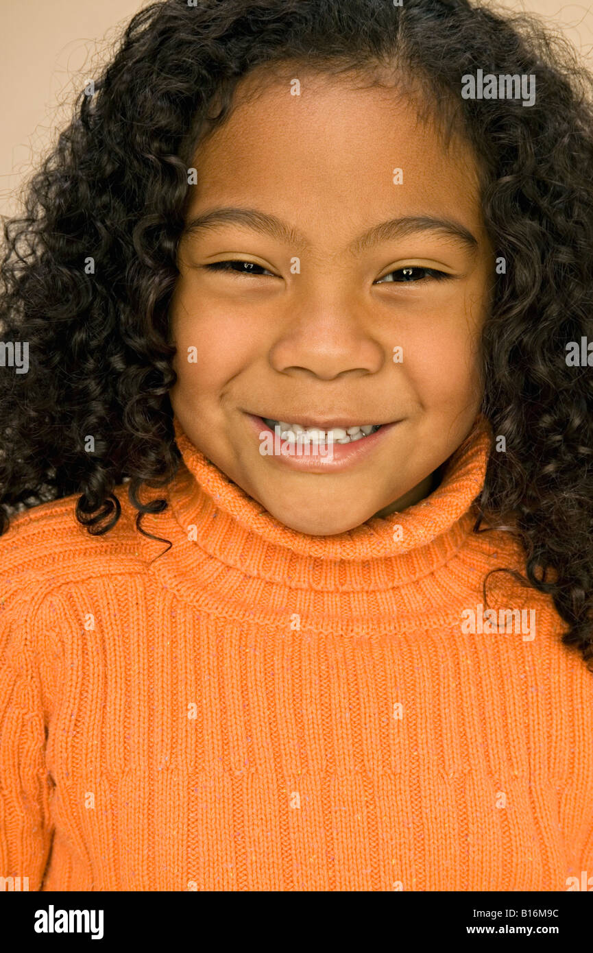 Pacific Islander girl with curly hair Stock Photo - Alamy