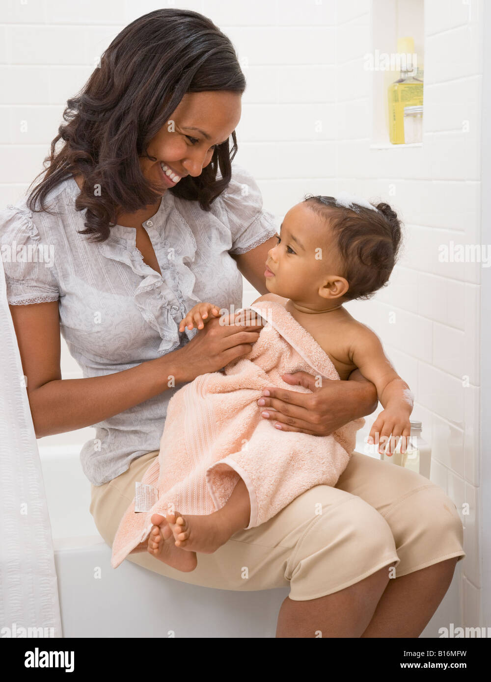 African American mother drying off baby Stock Photo - Alamy