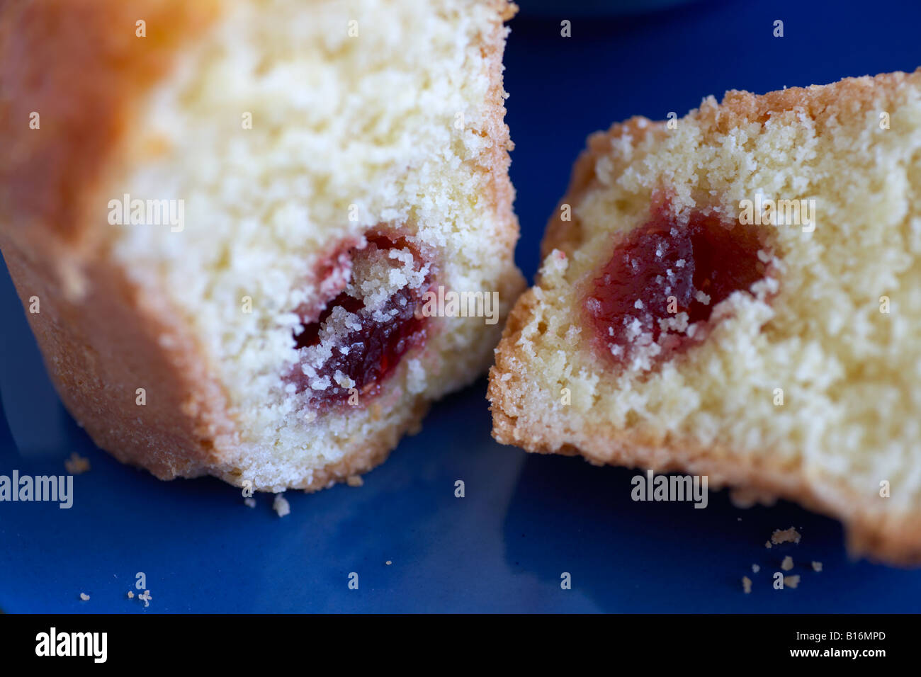 Small French sponge cake with jam Stock Photo - Alamy