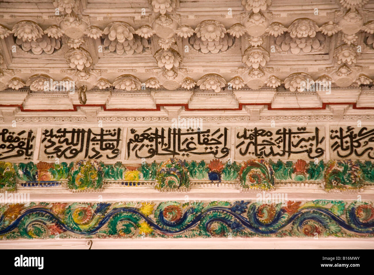 Calligraphy and ornate carving in the ceilings of one of the mosques in ...