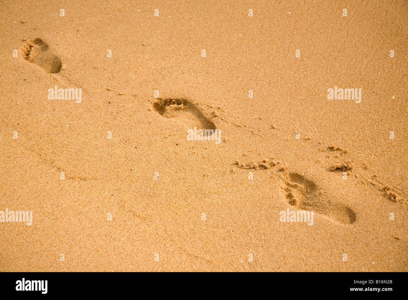 Footsteps on the beach at Managlore, Karnataka. The beach is pleasantly ...