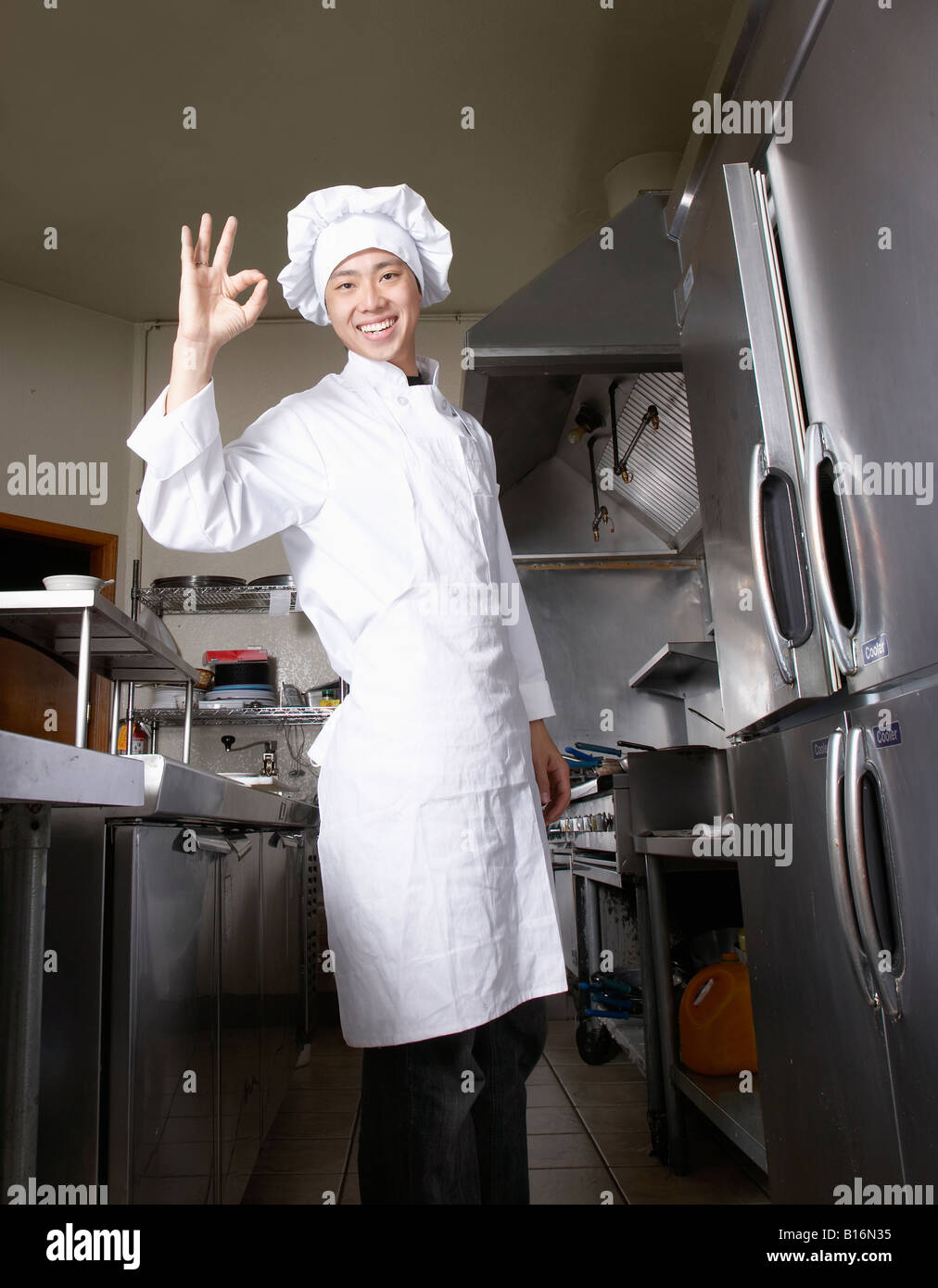 Asian male chef making OK hand gesture Stock Photo - Alamy