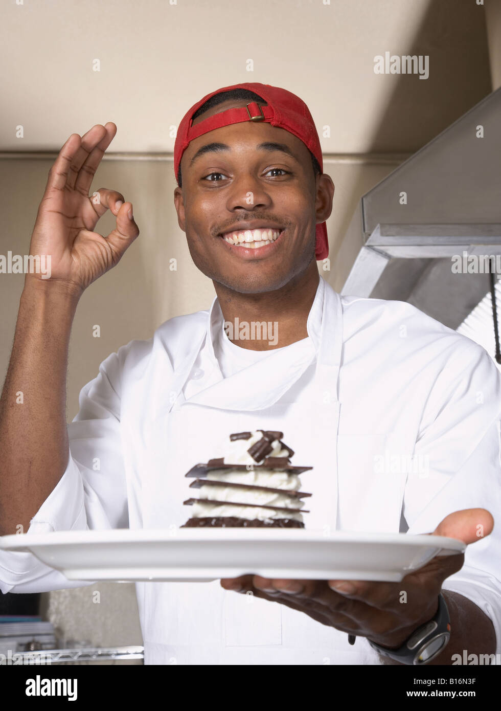 African American male chef holding desert Stock Photo - Alamy