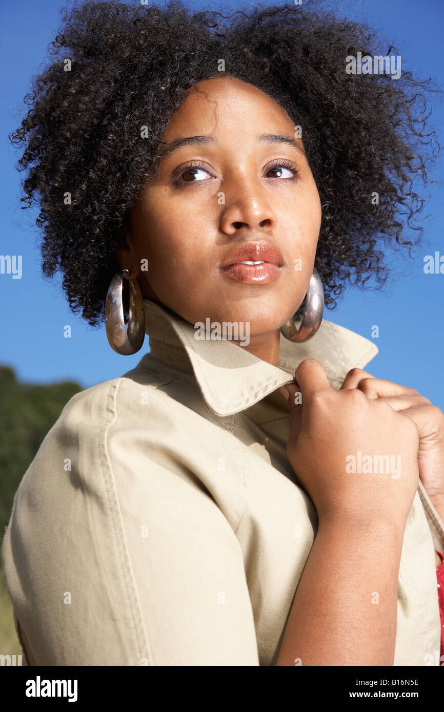 African woman holding jacket collar Stock Photo - Alamy