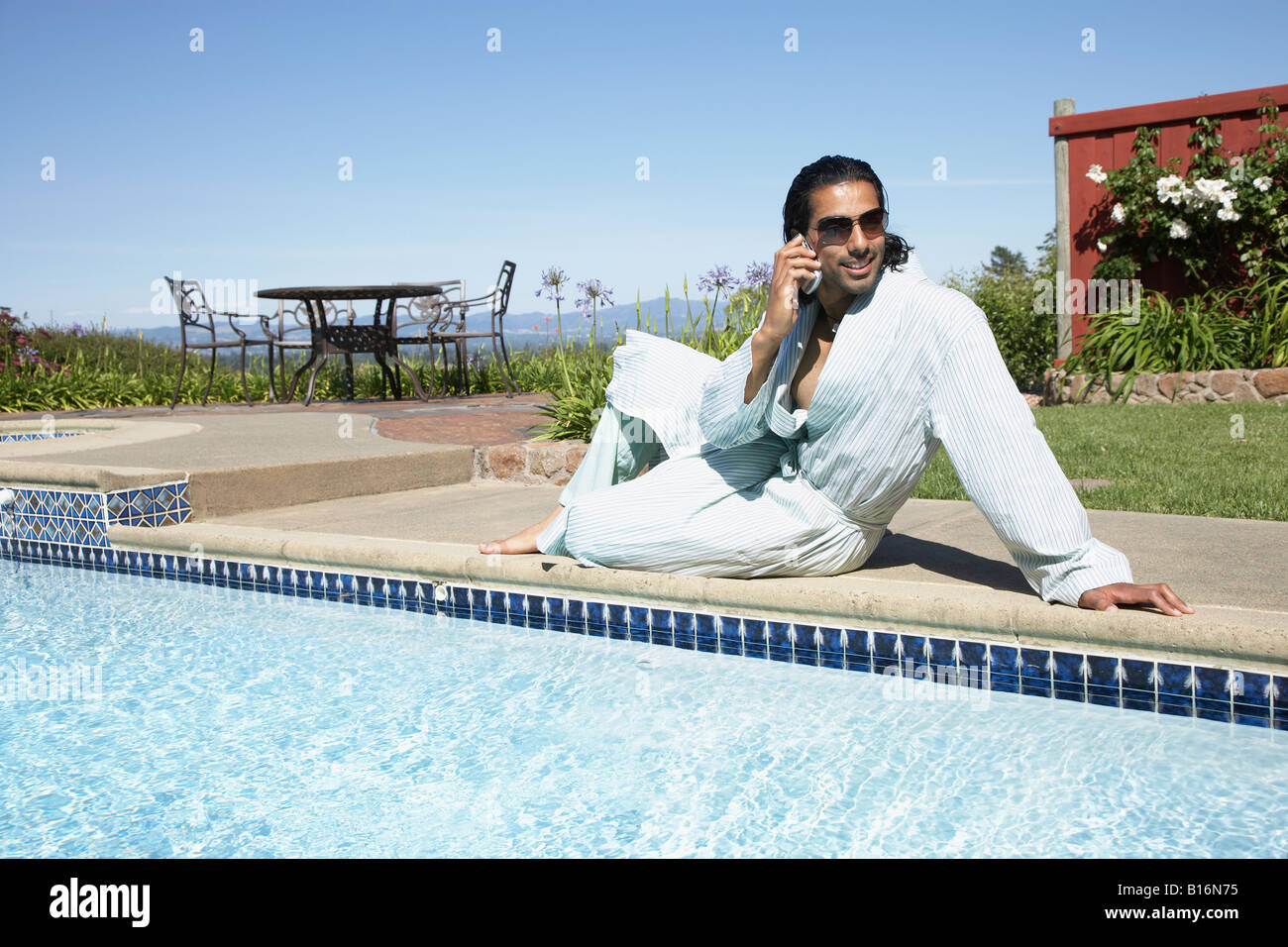 Indian man talking on cell phone Stock Photo - Alamy