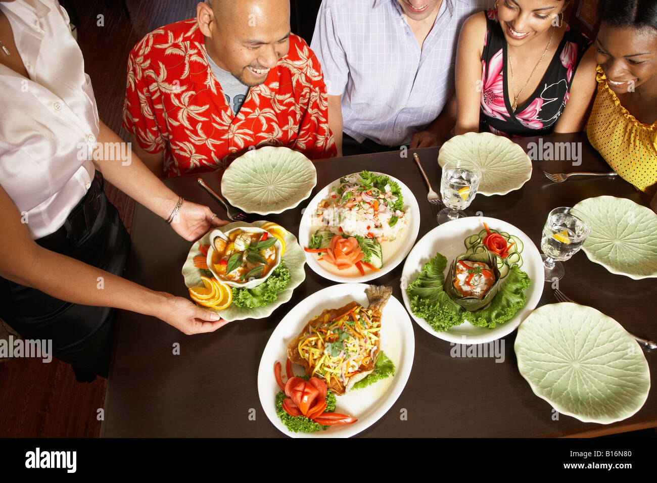 Thai waitress holding food hi-res stock photography and images - Alamy