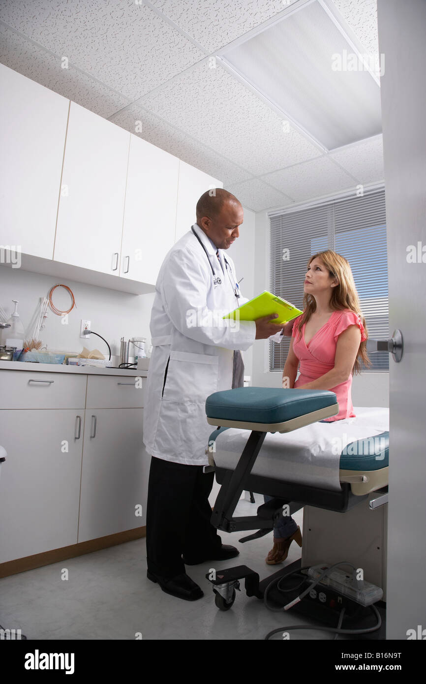 African American male doctor talking to patient Stock Photo - Alamy