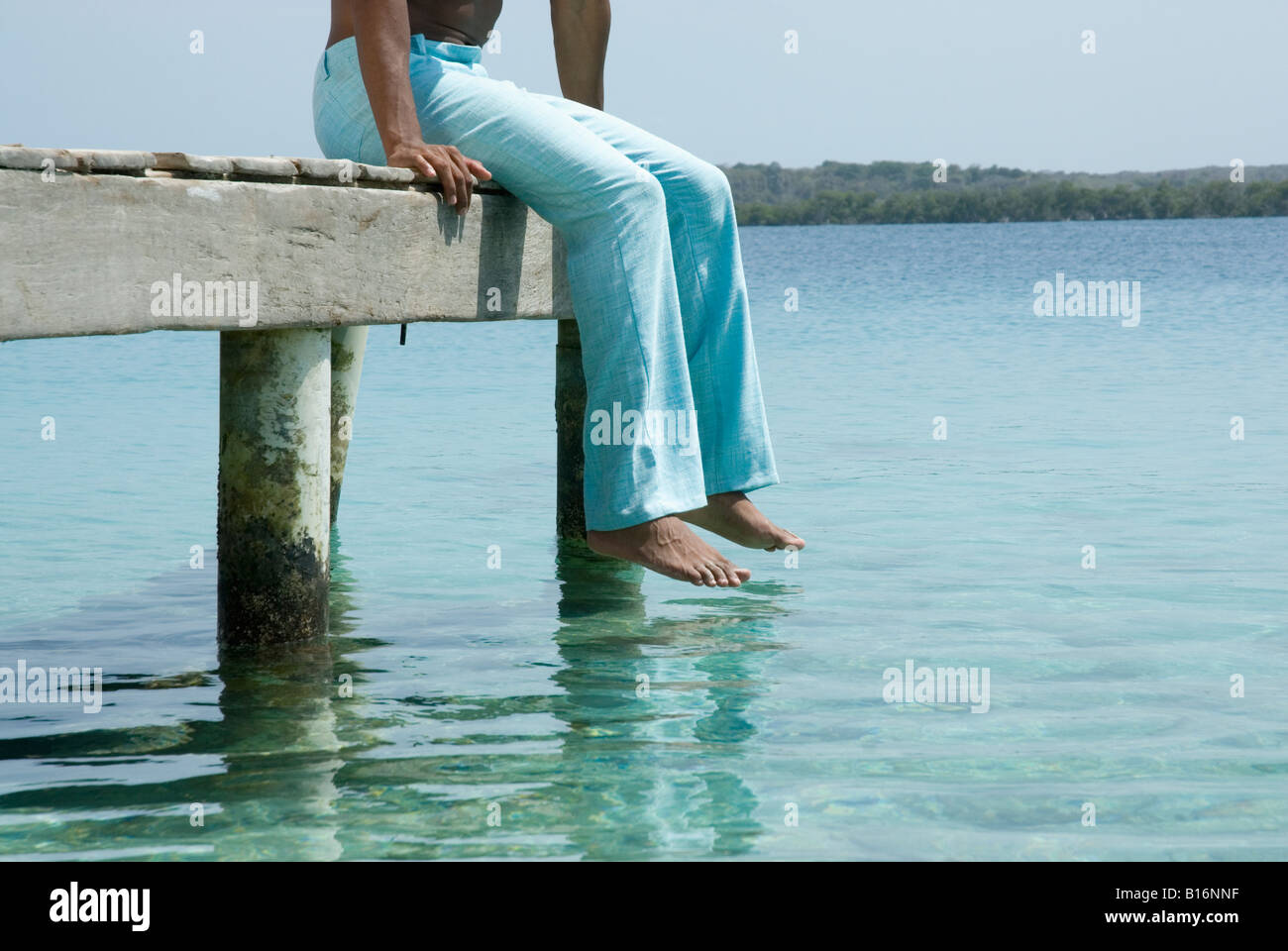 Man Sitting On Dock High Resolution Stock Photography and Images - Alamy