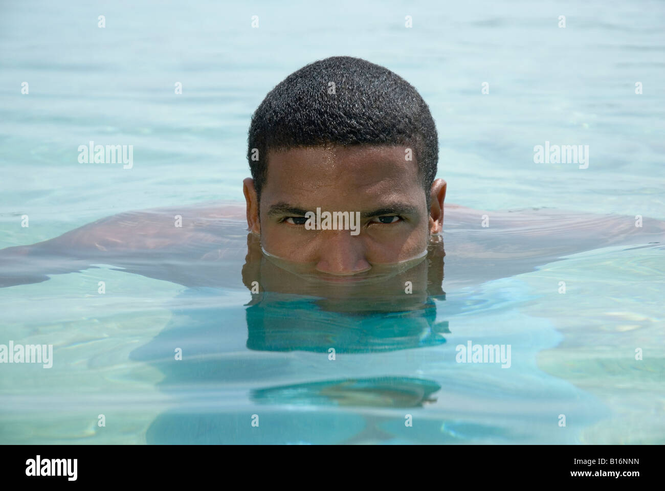 Hispanic man in water Stock Photo - Alamy
