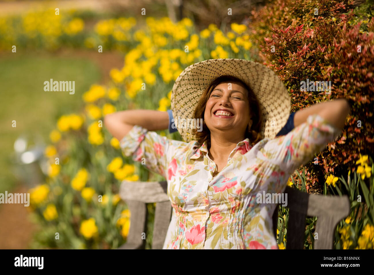 Hispanic woman wearing sun hat Stock Photo - Alamy
