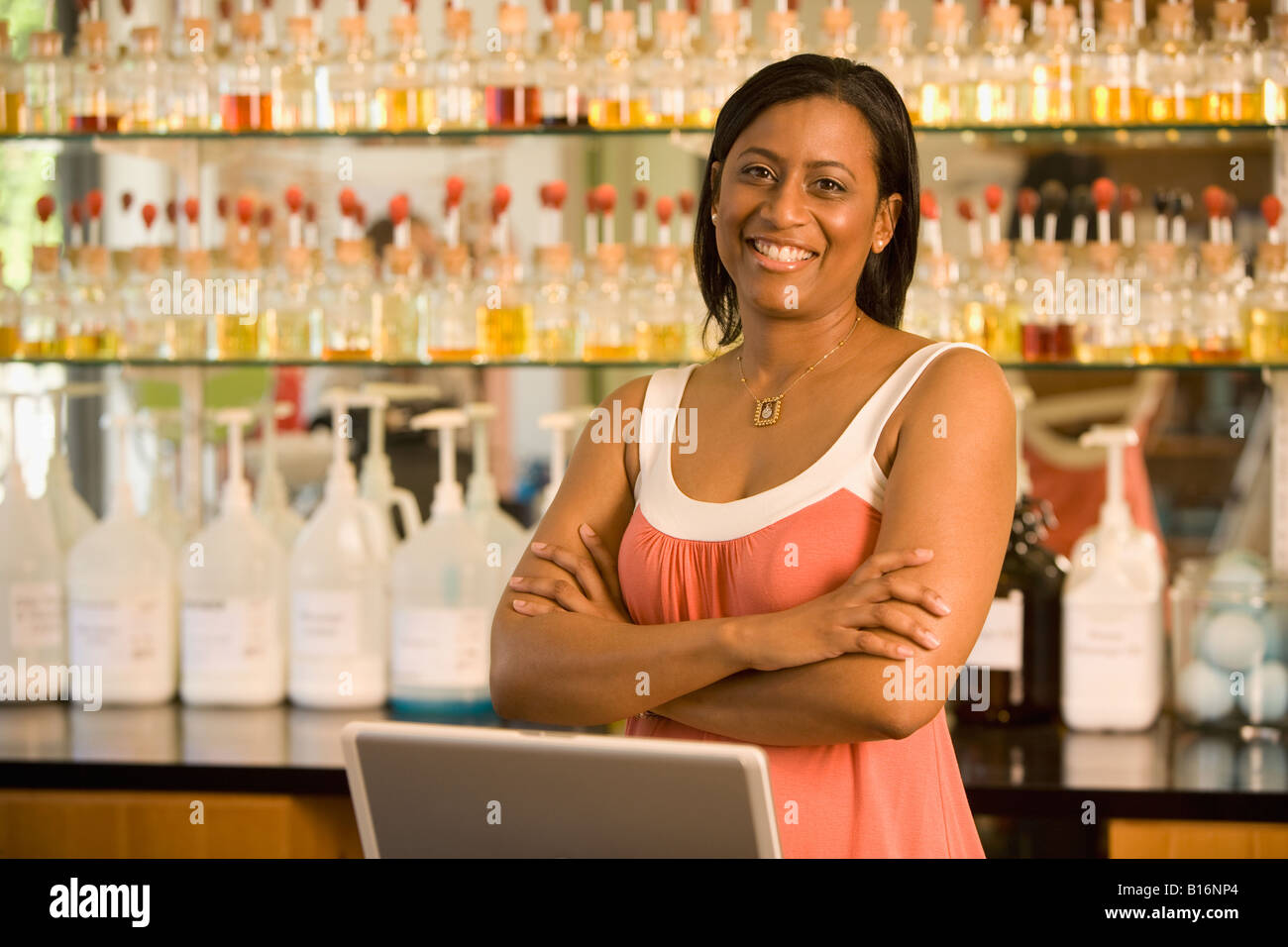 African American female sales clerk at perfume store Stock Photo - Alamy