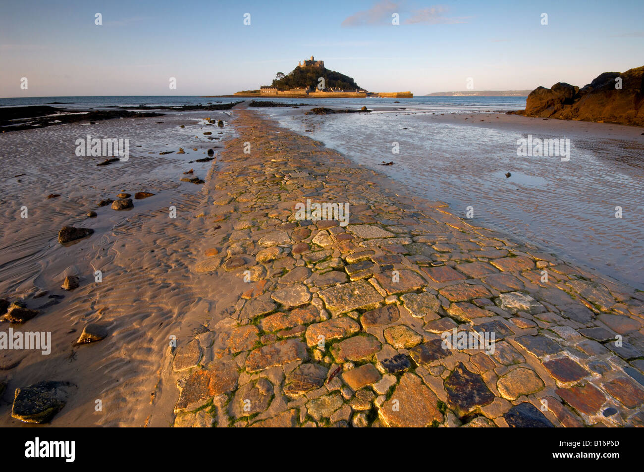 Dawn lighting up the old brick causeway leading to St Michaels Mount ...