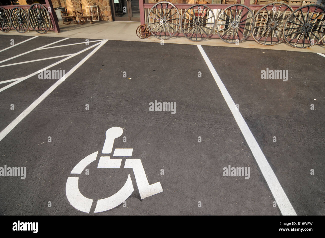 Handicapped parking sign and Buggy wheels in background Stock Photo - Alamy