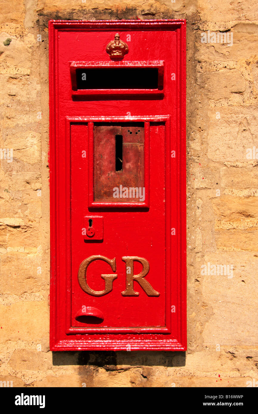 A red Post Box with GR picked out in gold lettering Stock Photo - Alamy