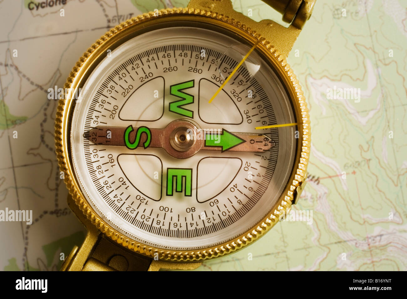 Lensatic sighting compass on a topographic map Stock Photo - Alamy