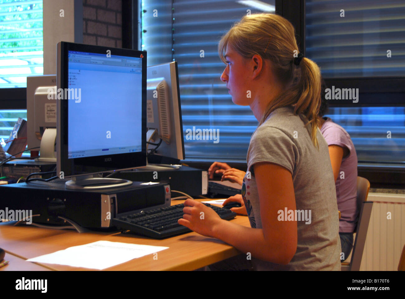 schoolgirl doing her schoolwork on computer Stock Photo - Alamy