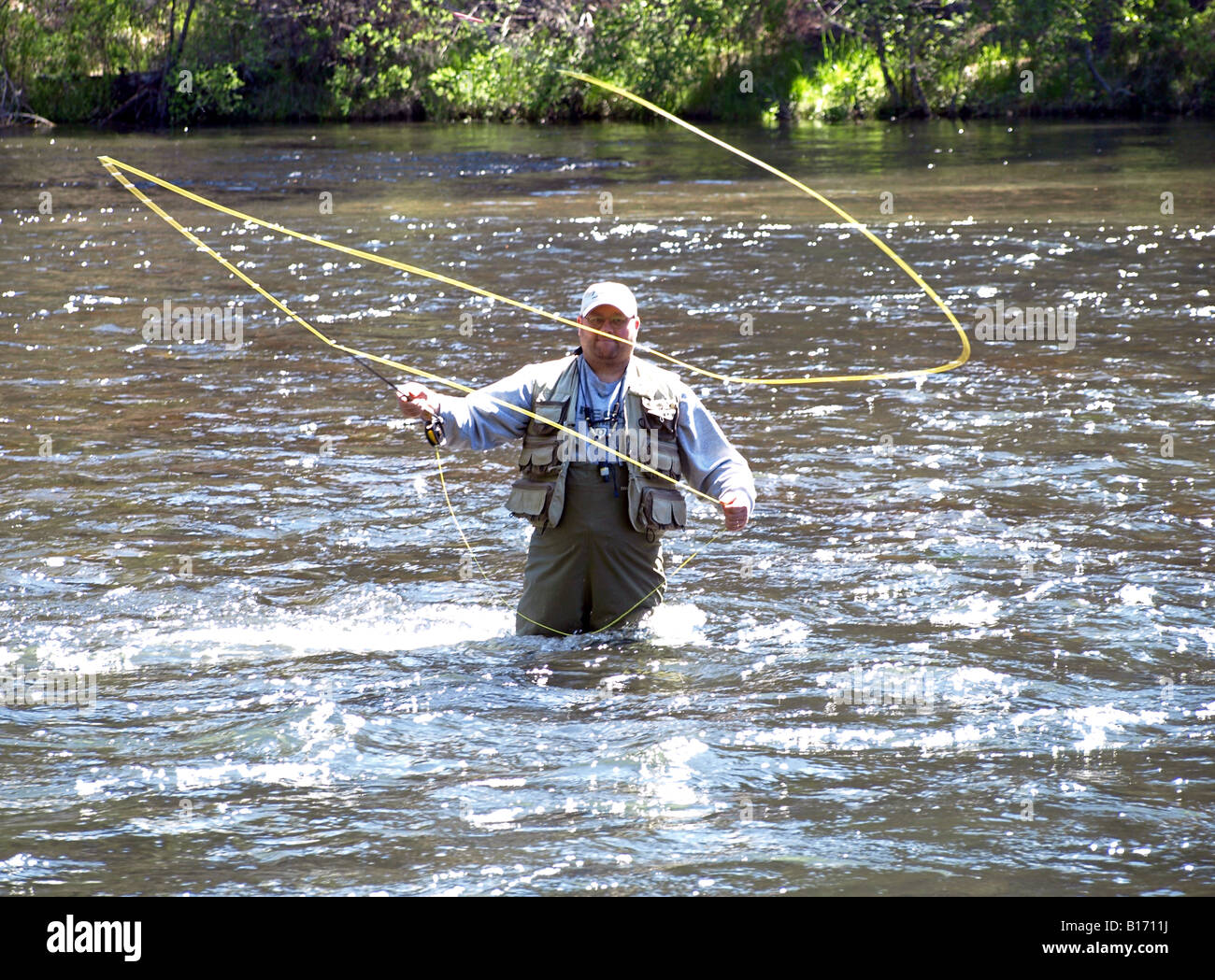 Flyfishing on the Metolius River during a warm spring day Stock Photo ...
