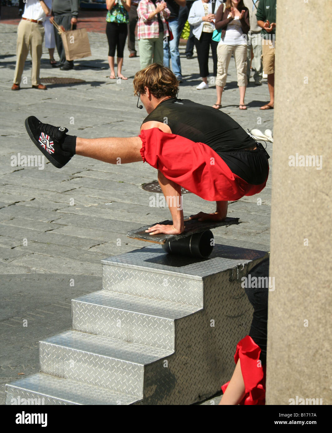 Street performers in downtown boston doing acrobatics Stock Photo - Alamy