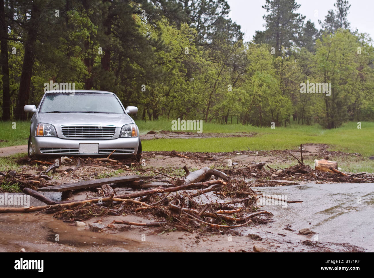 Luxury sedan caught in a flash flood caused by several days of rain ...