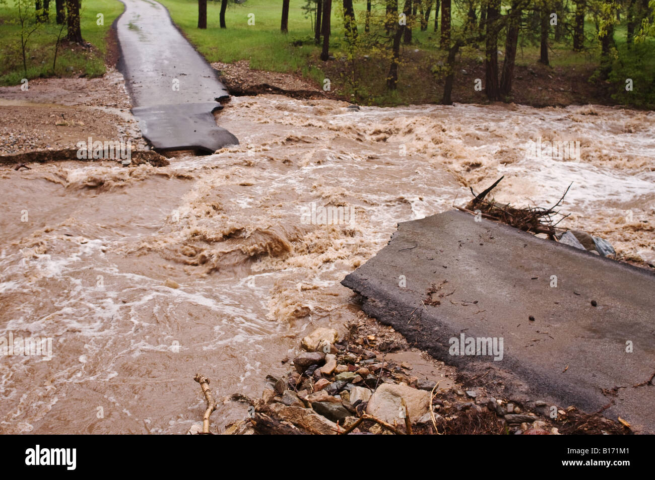 Several days of rain caused a small stream to flood and wash out a ...