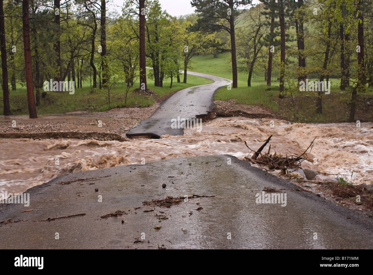 Several days of rain caused a small stream to flood and wash out a ...