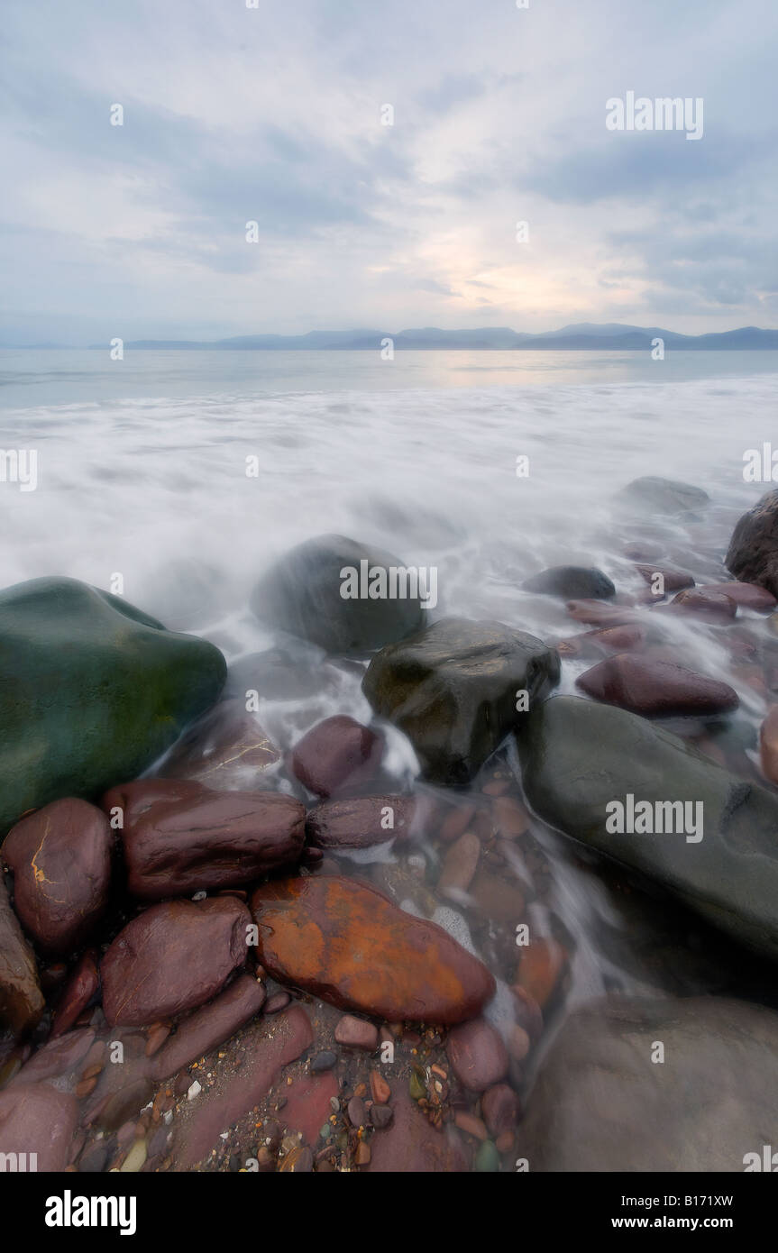 water gives translucent effect moving over foreground rocks Stock Photo ...