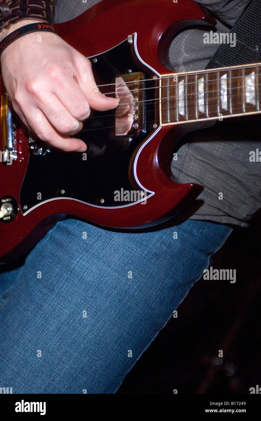 Rock band guitarist Stock Photo - Alamy