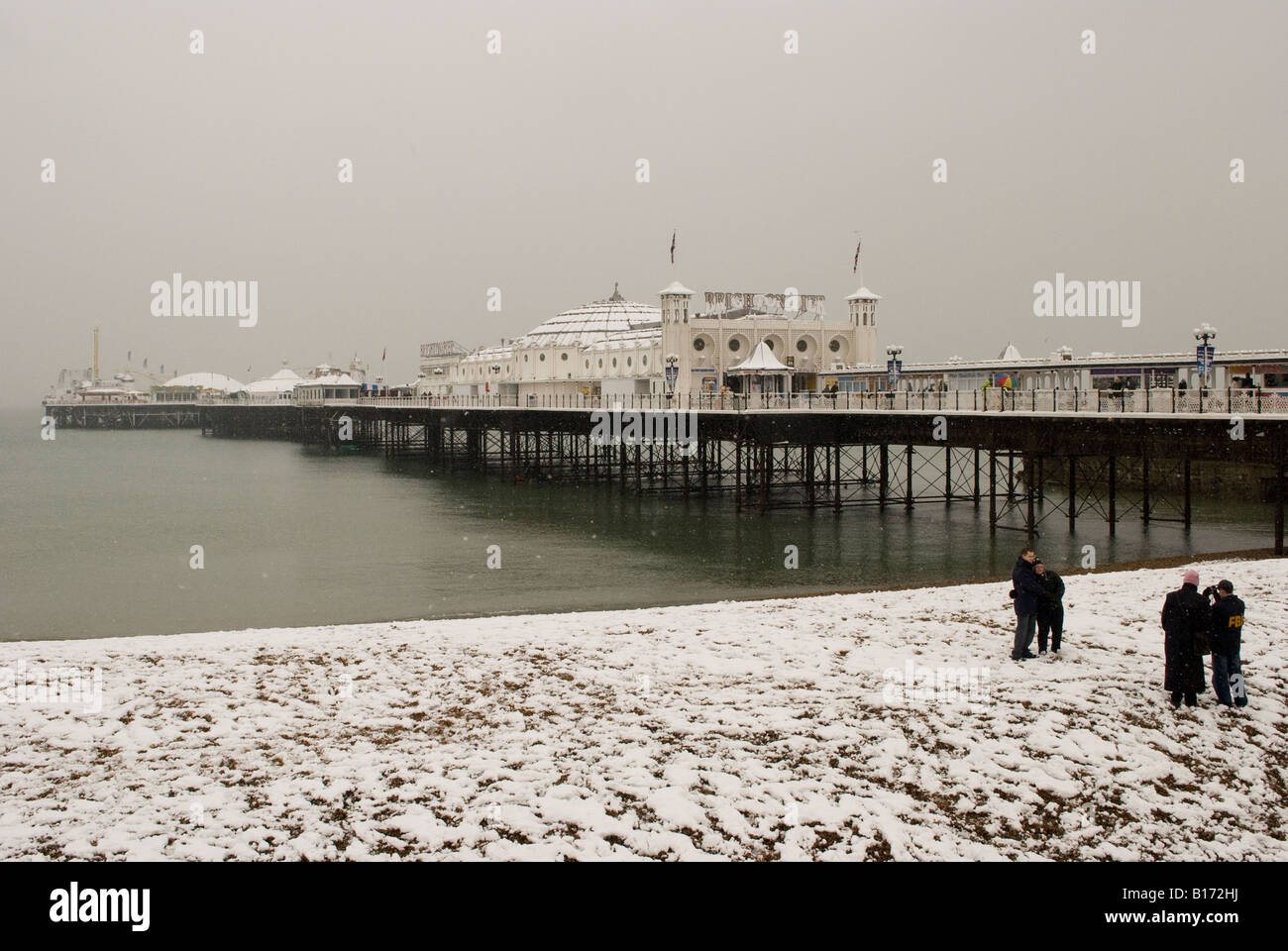 UK England Sussex, Winter: Brighton Pier and beach in snow Stock Photo ...