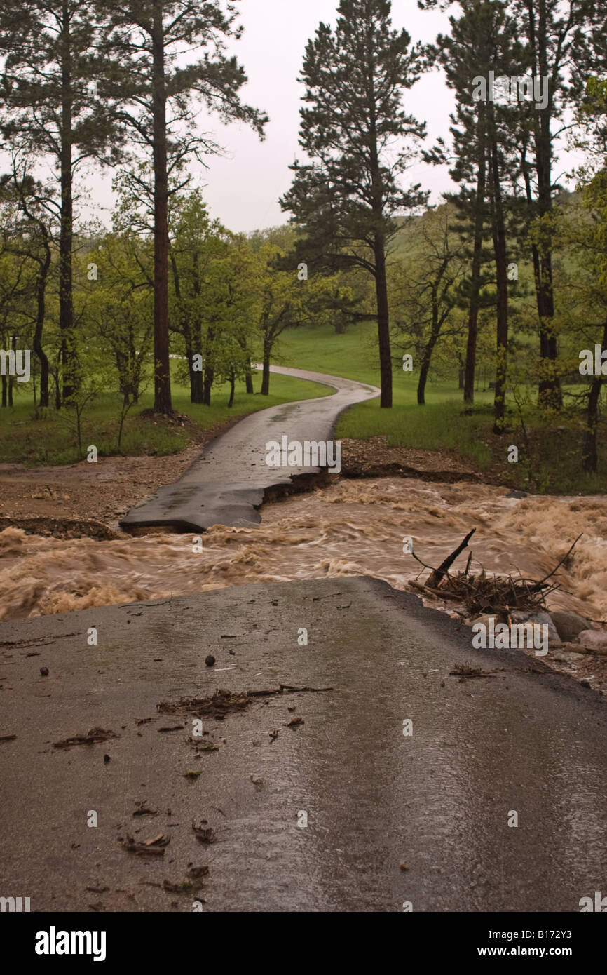 Several days of rain caused a small stream to flood and wash out a ...