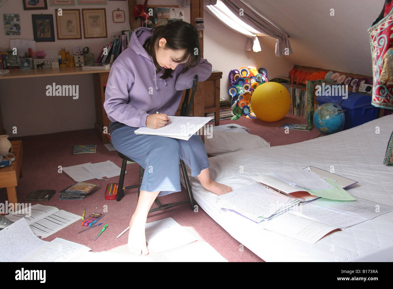 Teenage Girl Studying in Bedroom Stock Photo - Alamy