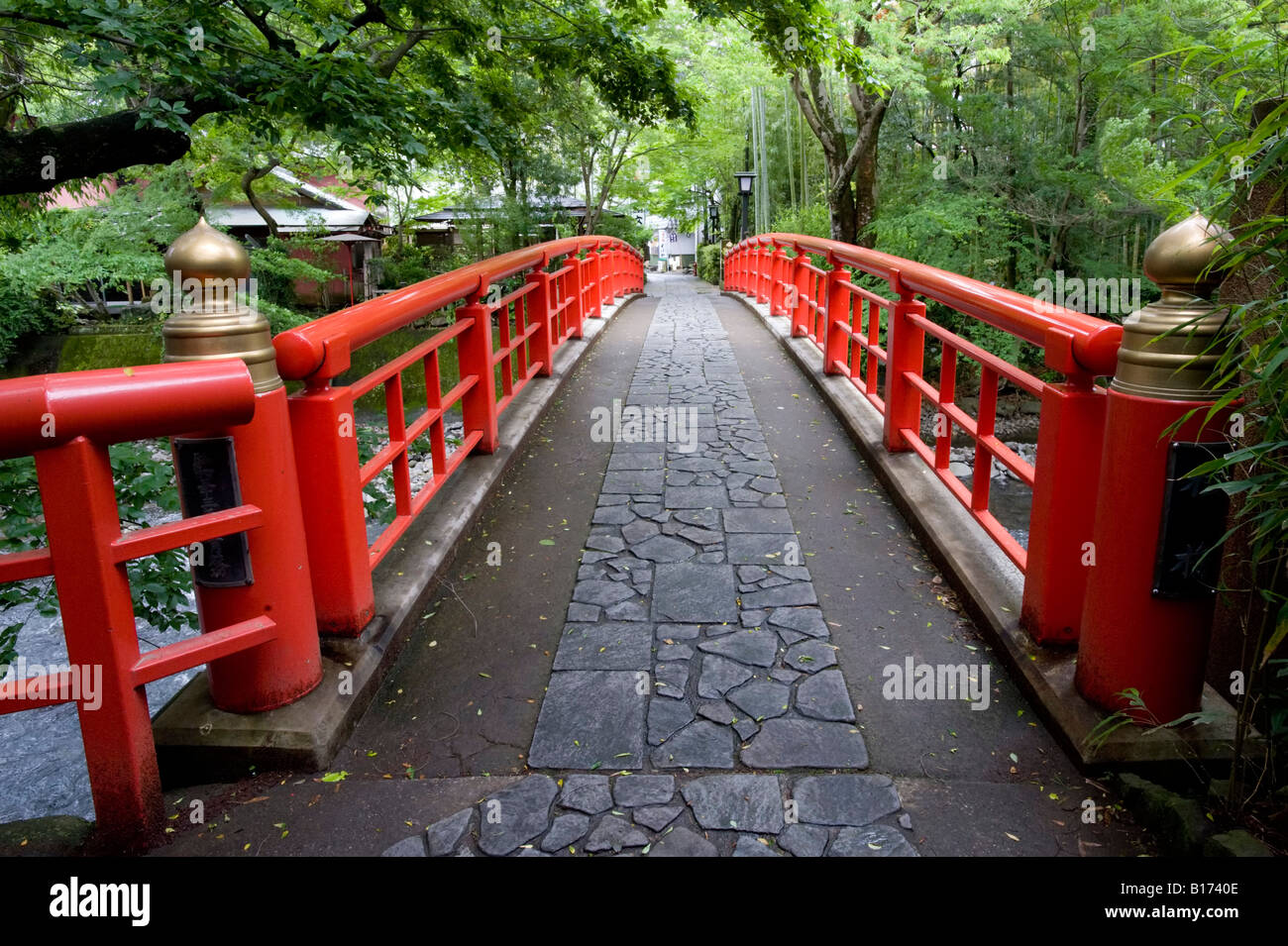 Red wooden bridge crossing river in village of Shuzenji on Izu ...